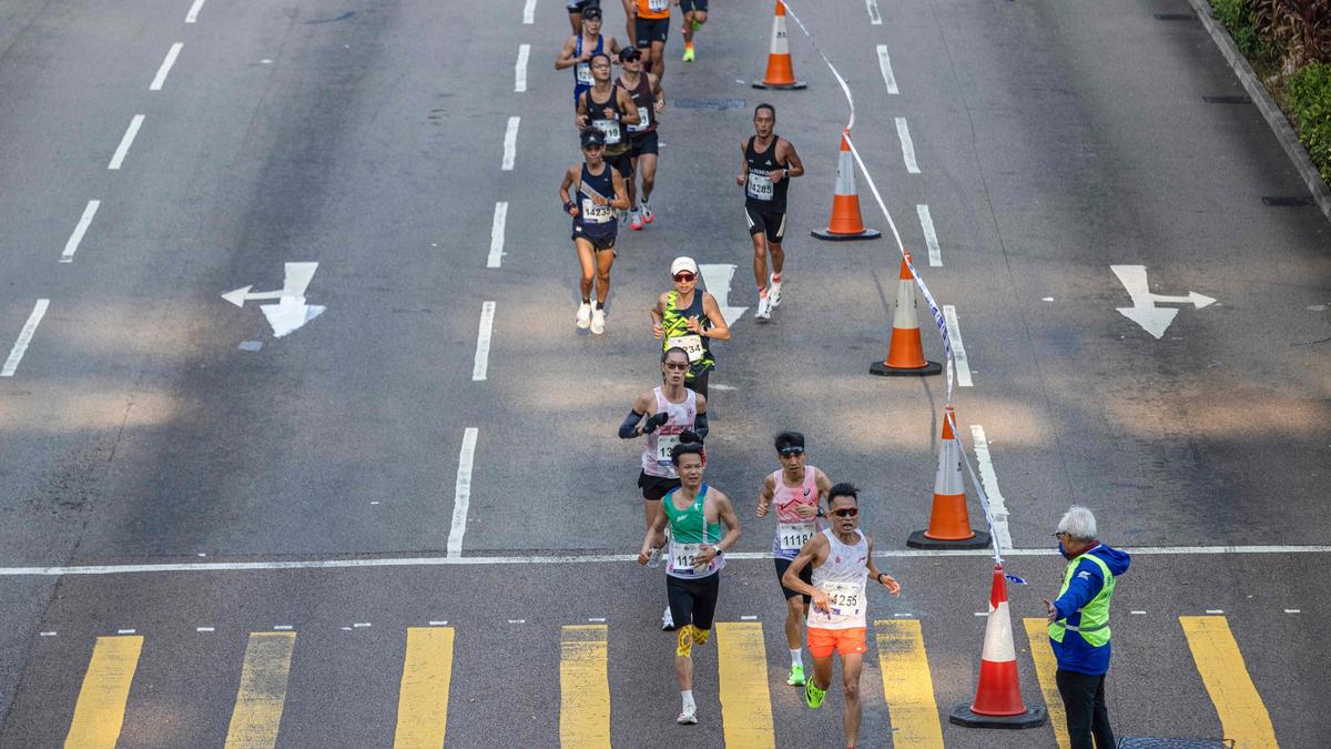 Hong Kong marathon runner with baby investigated for child abuse ...